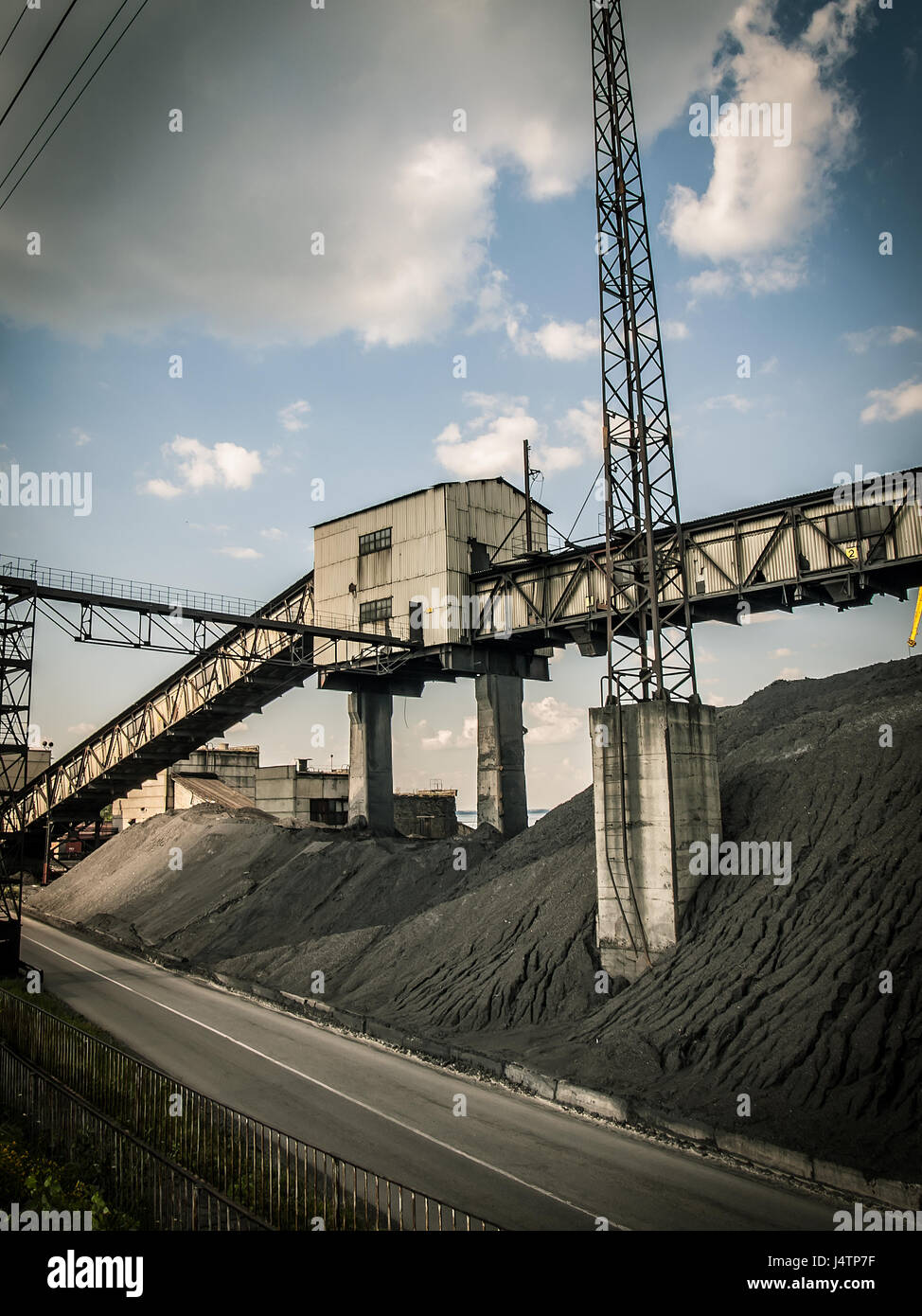 Coal mine heaps of coal on the mining site with cloudy sky Stock Photo ...
