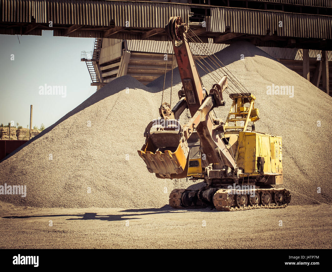 Old excavator on the stone quarry production site at work Stock Photo ...