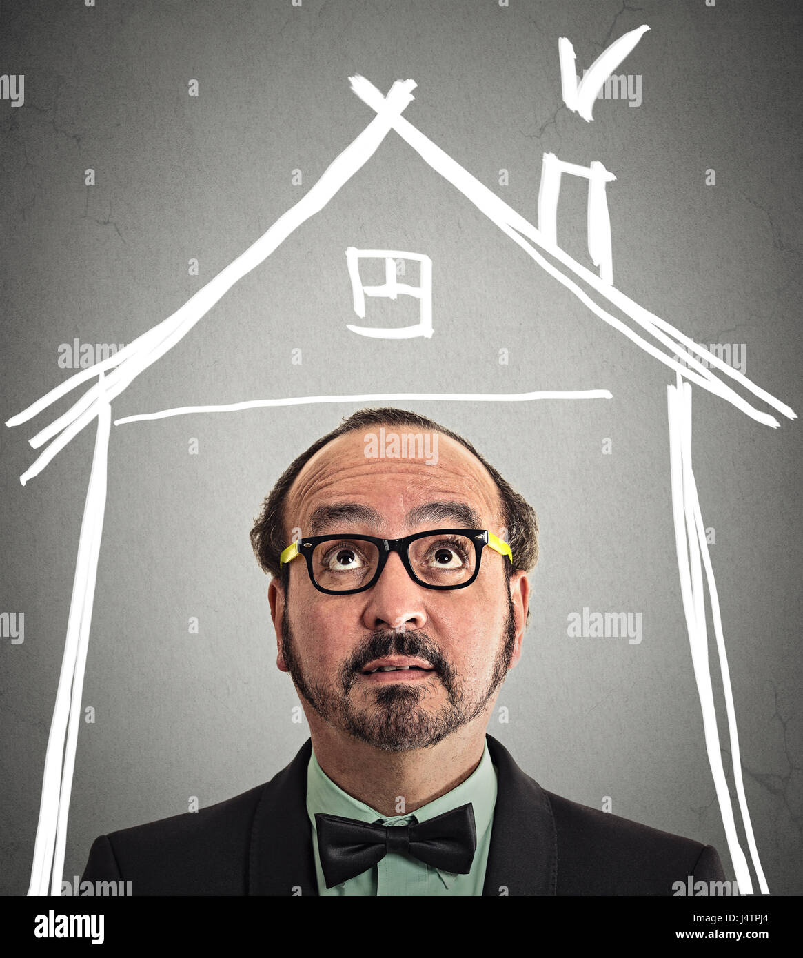 closeup portrait headshot businessman looking up house roof above head ...