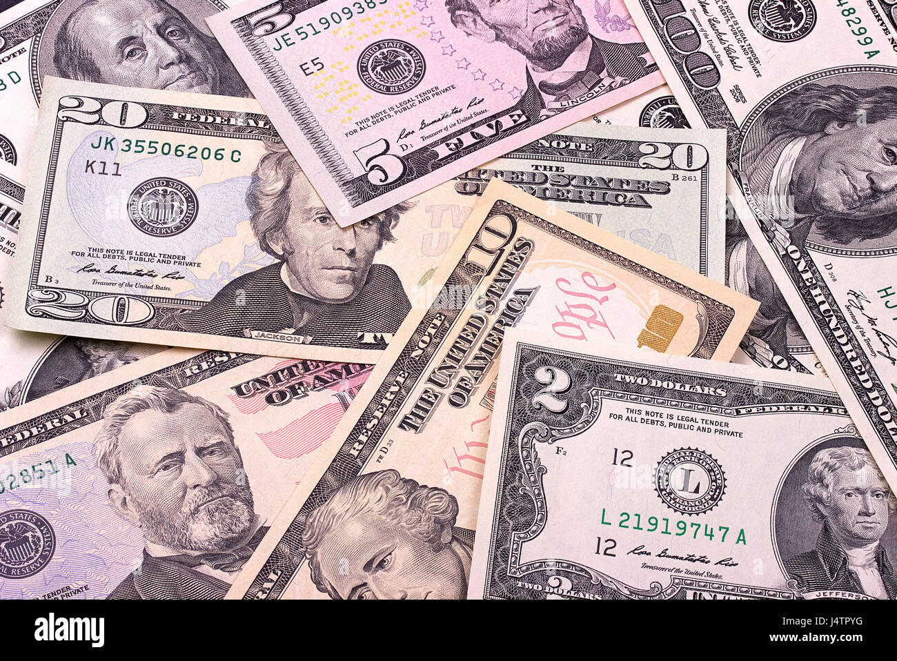 Abstract dollar bills of different denominations background Stock Photo ...