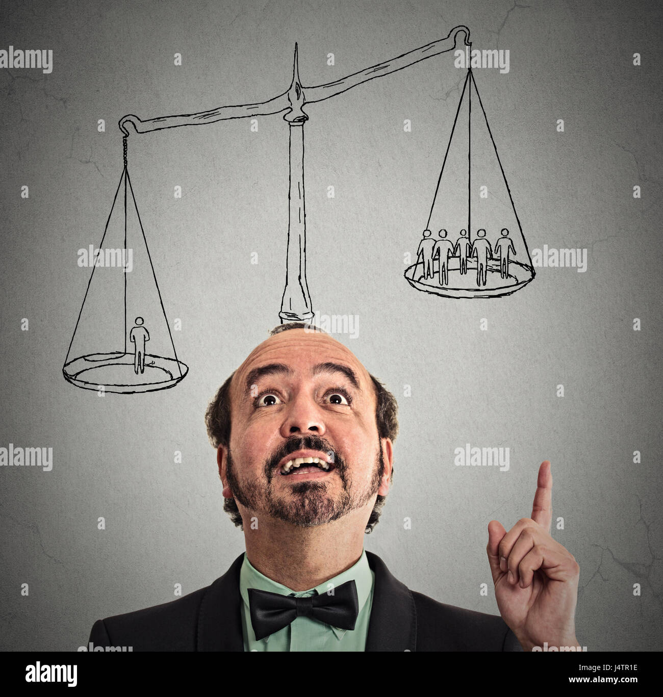 businessman with scale above head has idea solution one man weighting ...