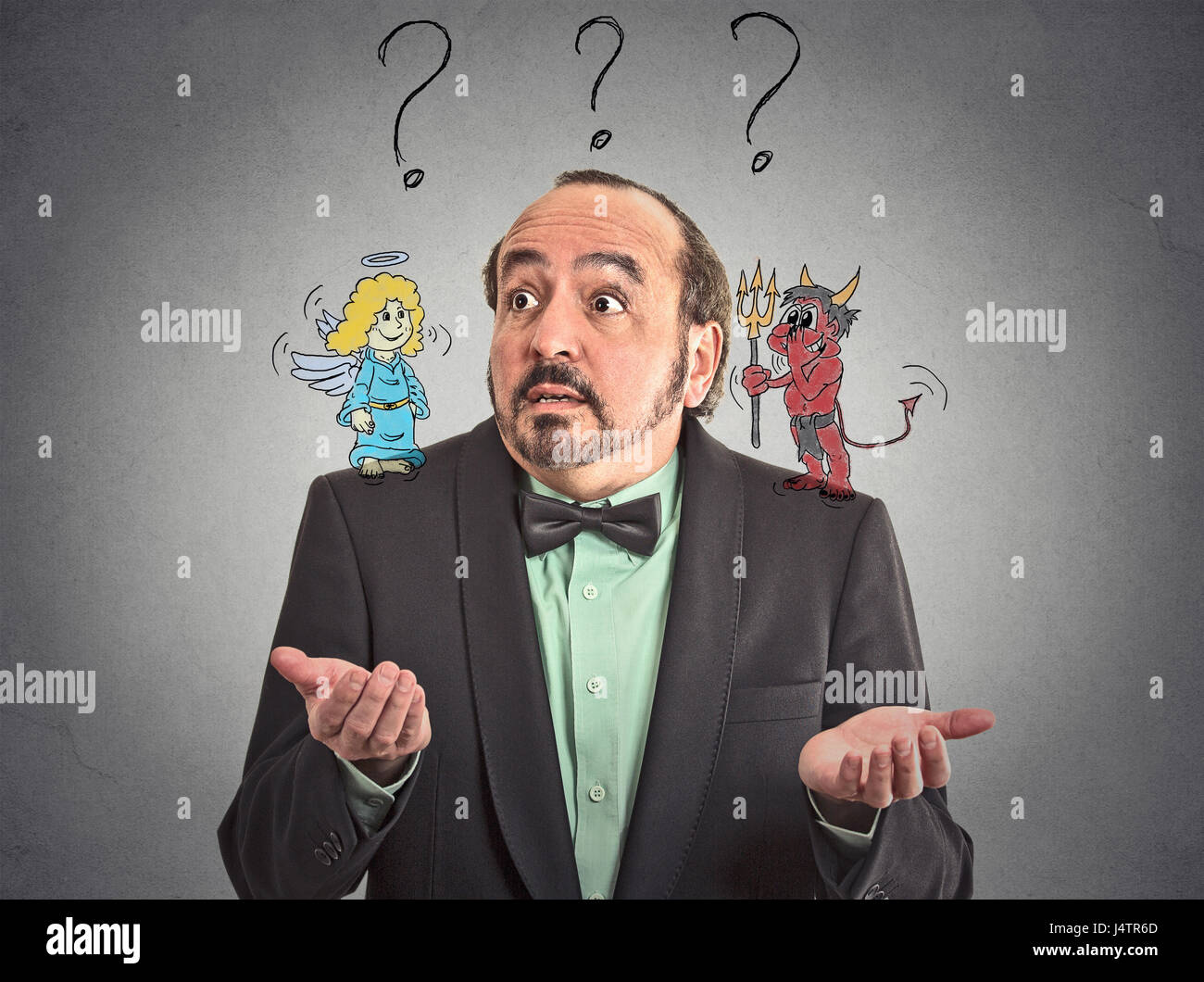 Confused man with angel and devil on his shoulders uncertain what ...