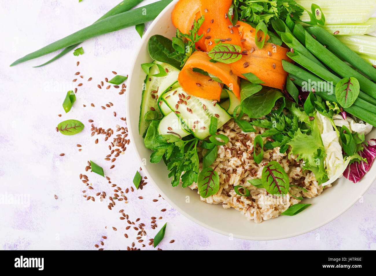 Diet menu. Healthy lifestyle. Oat porridge and fresh vegetables ...