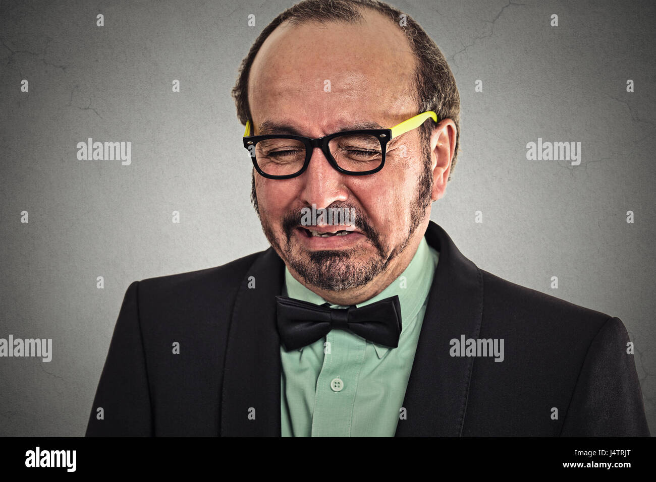 crying man isolated on grey wall background negative emotion feelings ...