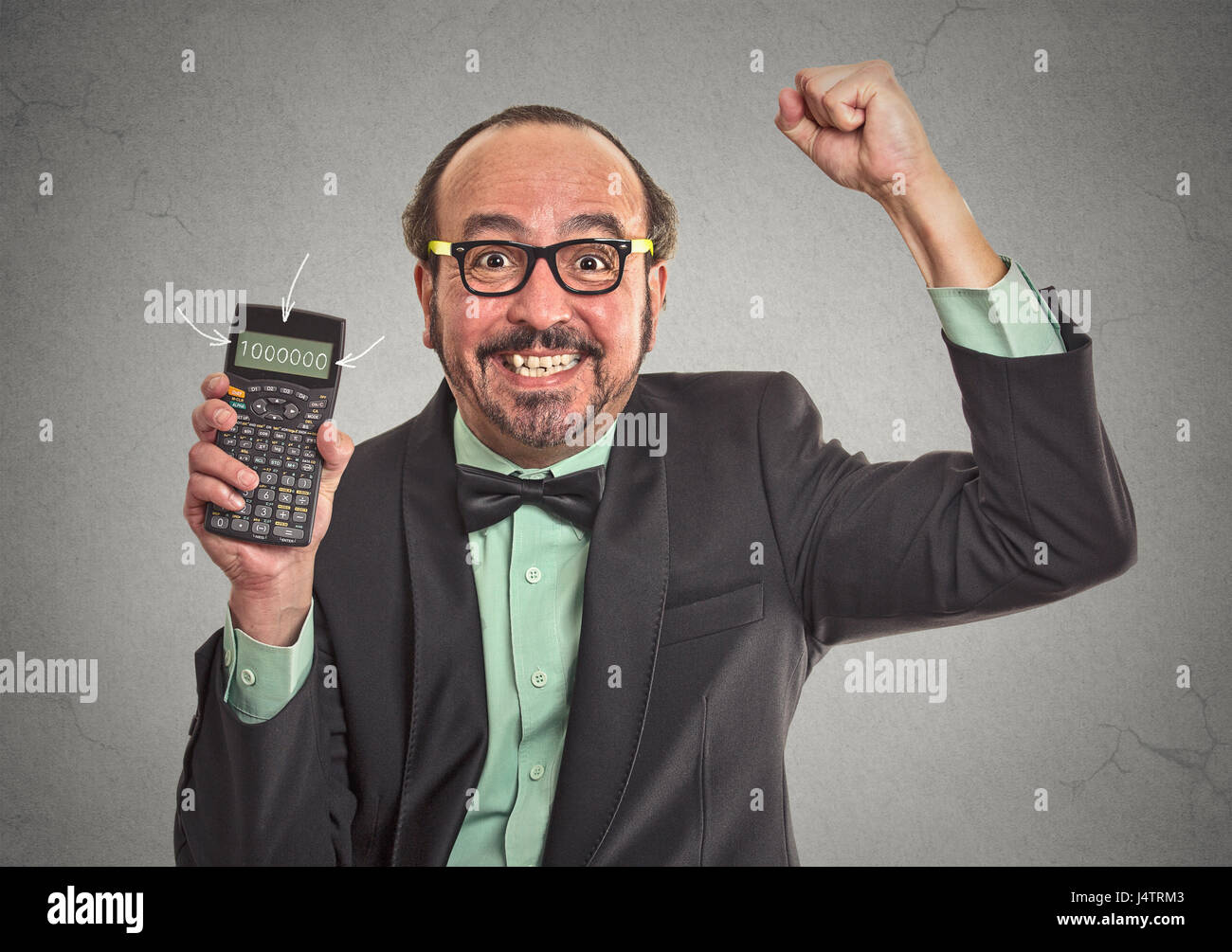 Excited happy businessman showing calculator with million number sign ...