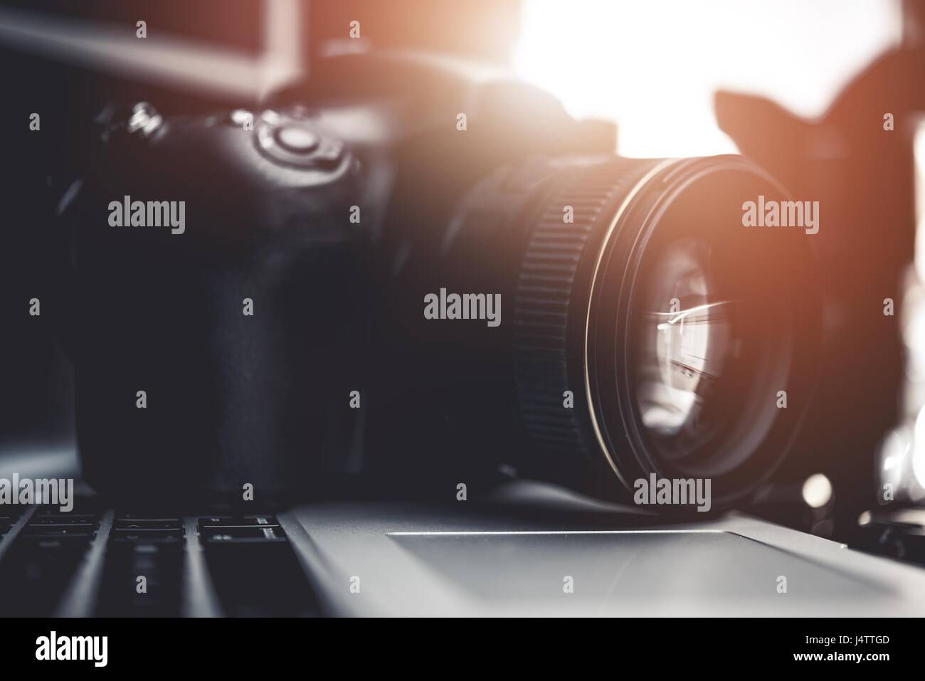 Digital Camera on the Laptop Computer Closeup Photo. Photographers Desk ...