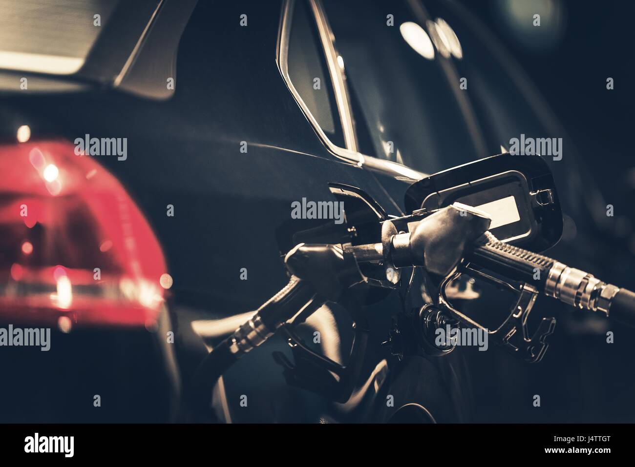 Gasoline Car Refueling Closeup Photo. Night Time Vehicle at the Gas ...