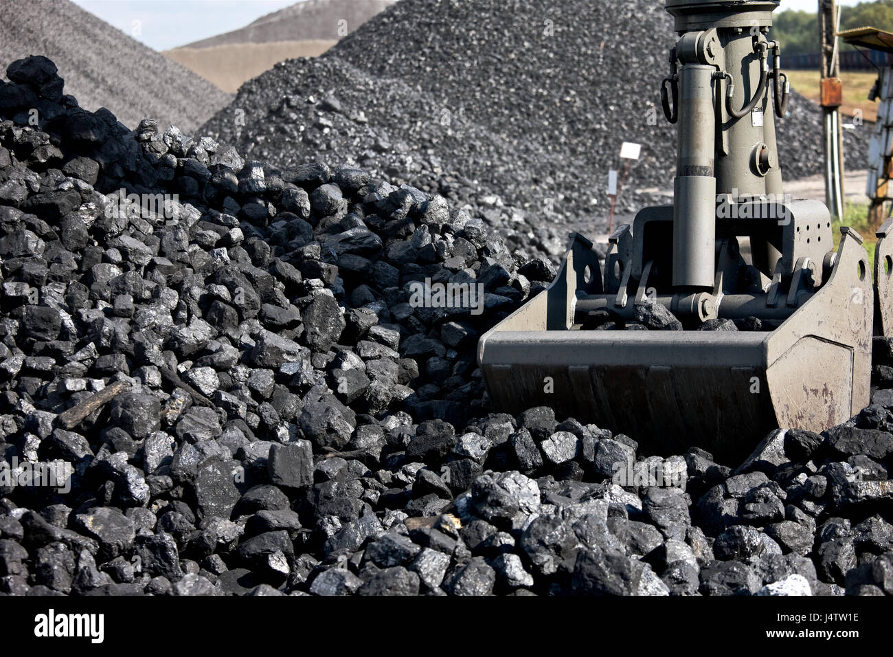 Coal loading excavator, heaps of coal Stock Photo - Alamy