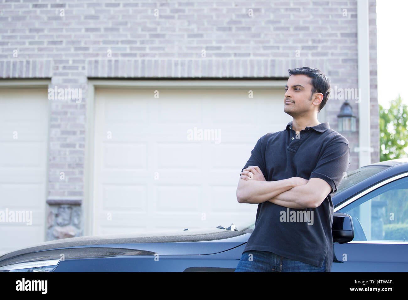 Closeup portrait, young man in black polo shirt thinking about his ...