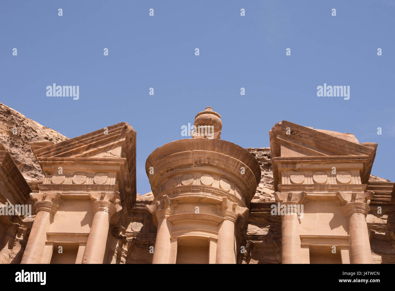 Close up of the carved facade of the Ad-Deir Monastery in Petra Jordan ...