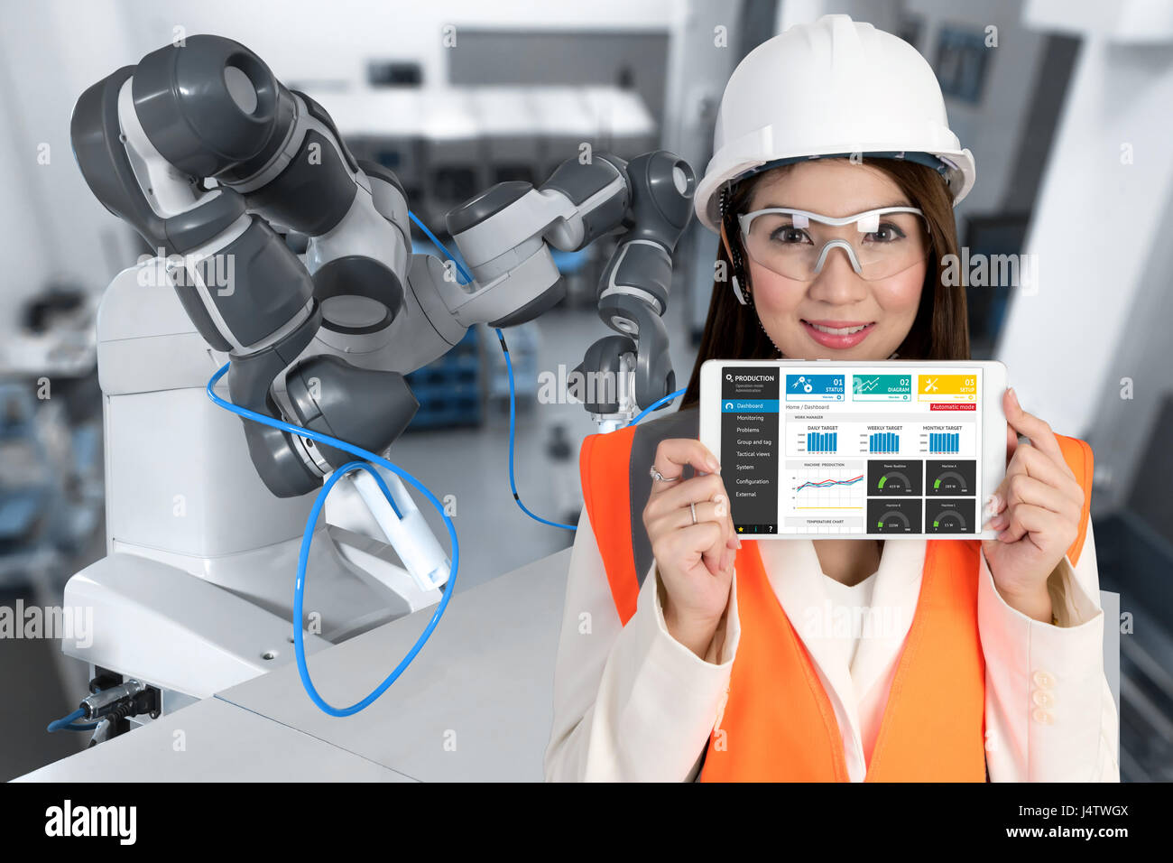 Smile young Asia female Engineer using tablet , wear glasses ...