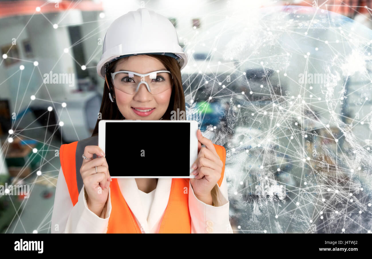 Smile young Asia female Engineer holding black screen tablet , wear ...