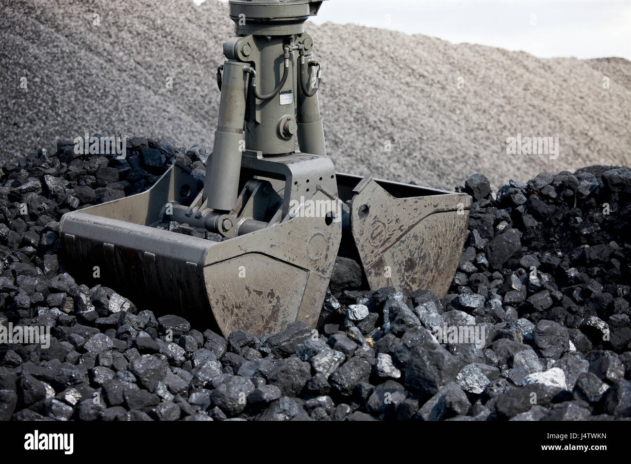 Coal loading excavator, heaps of coal Stock Photo - Alamy