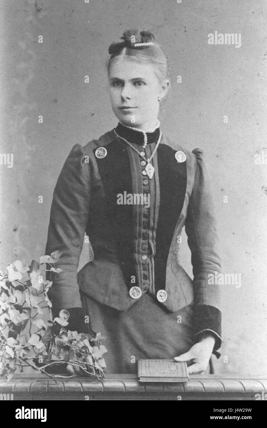 A historical photograph or illustration titled 'Woman 1900a hg' depicts ...