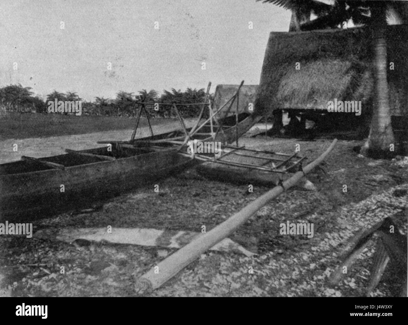 This image showcases a traditional house and canoe from Nauru, an ...