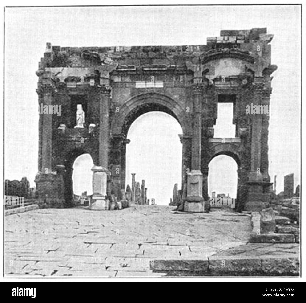 The Triumphal Arch of Trajan in Timgad, an ancient Roman city, stands ...