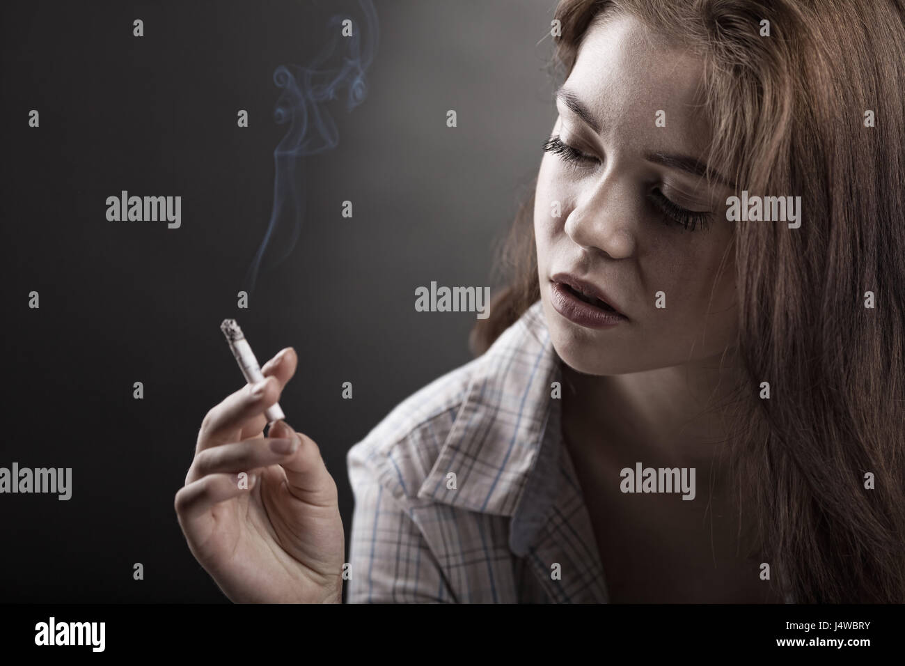 Crying woman with cigarette hi-res stock photography and images - Alamy