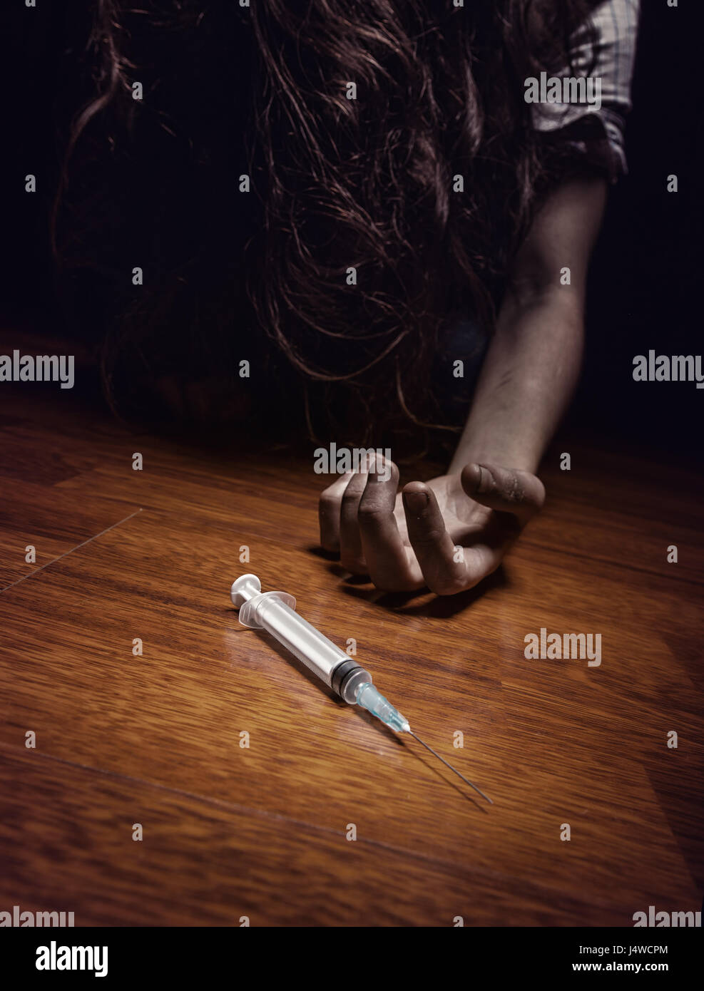 Close-up on the floor of the syringe with the drug. In the background ...