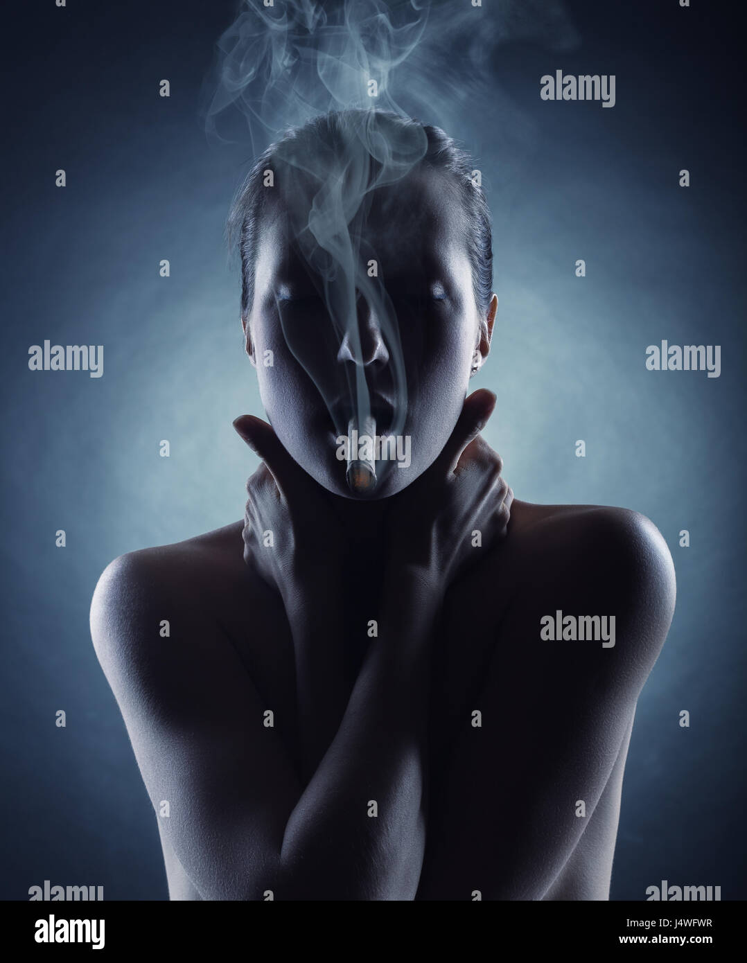Woman exhaling smoke hi-res stock photography and images - Alamy