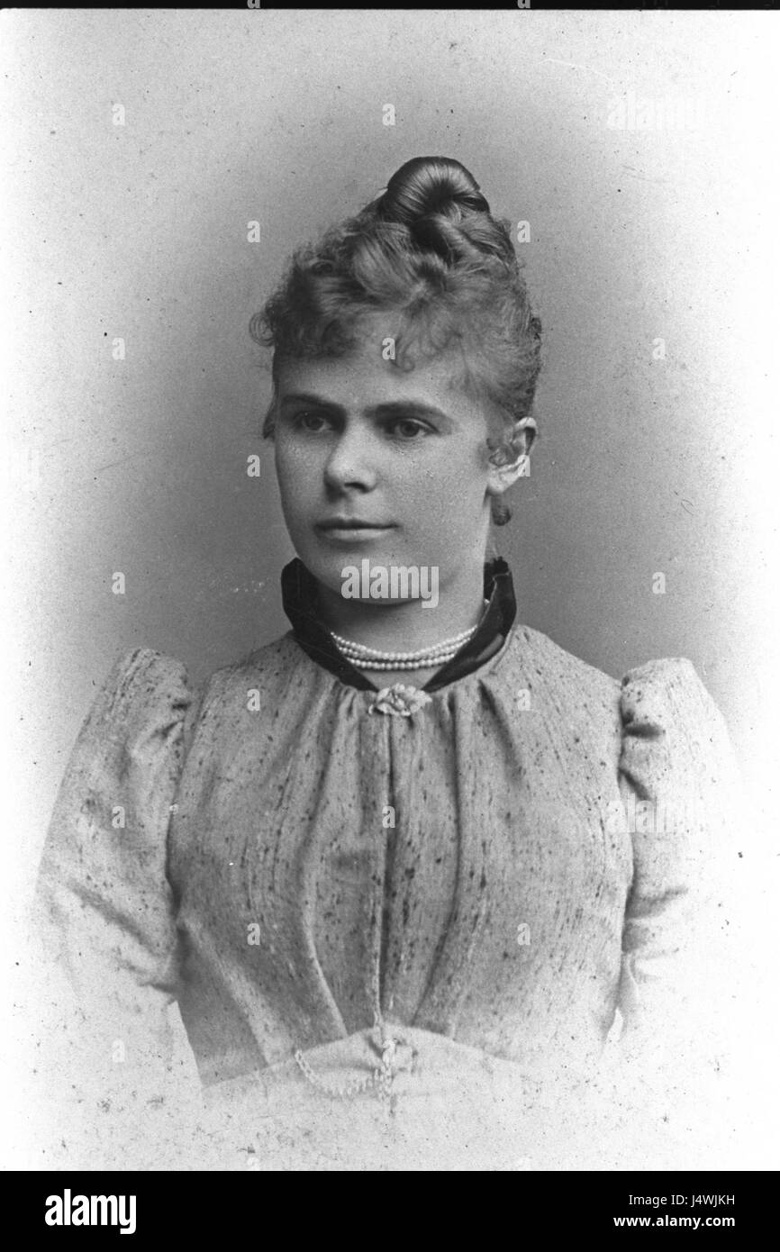 This photograph from 1900 captures a woman from the early 20th century ...
