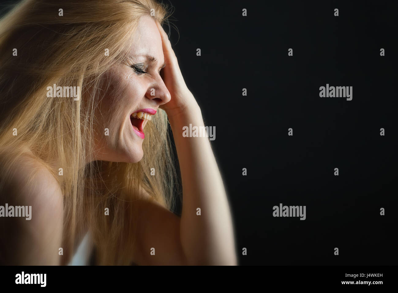 Crying woman on dark background Stock Photo - Alamy