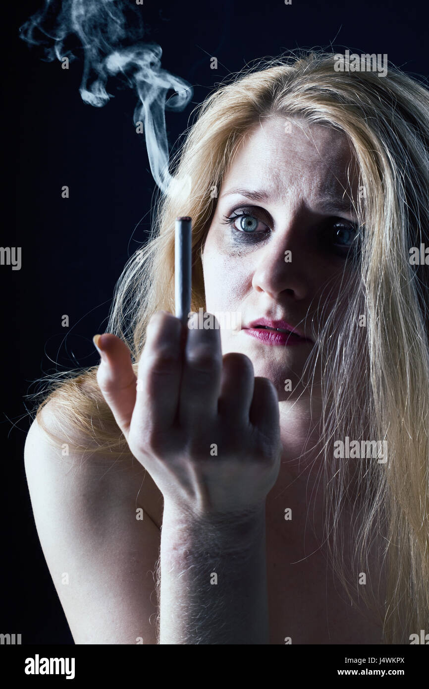 Crying woman with cigarette hi-res stock photography and images - Alamy