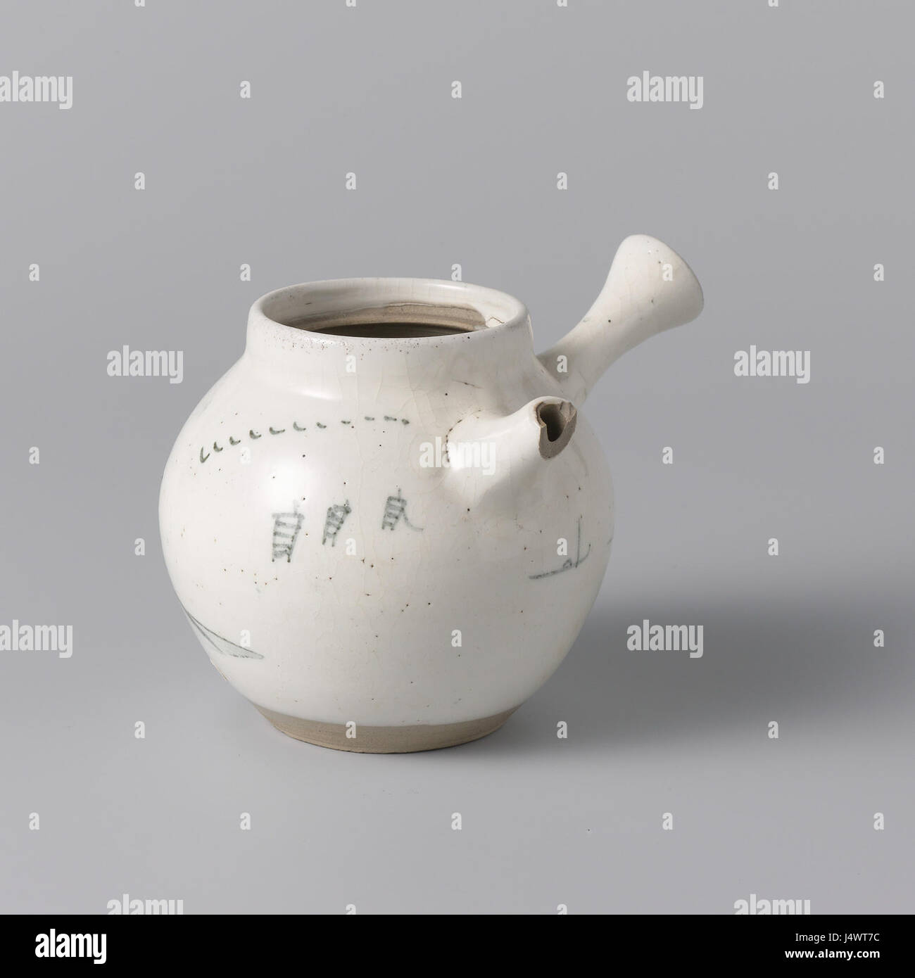 A piece of historical porcelain, identified as a teapot, housed in the ...