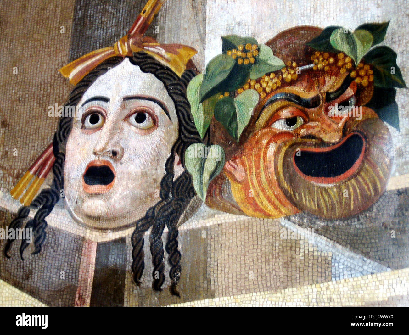 This Roman mosaic depicts tragic and comic masks, reflecting the ...