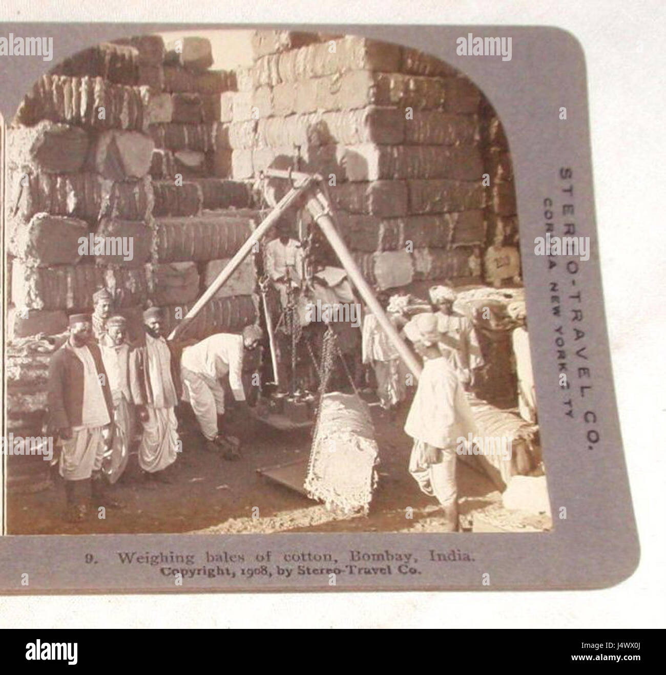 This image captures the process of weighing bales of cotton in Bombay ...