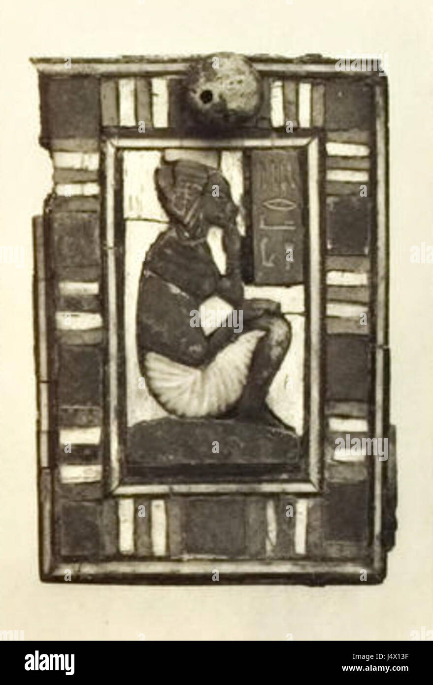 These photographs capture artifacts and scenes from the tomb of ...