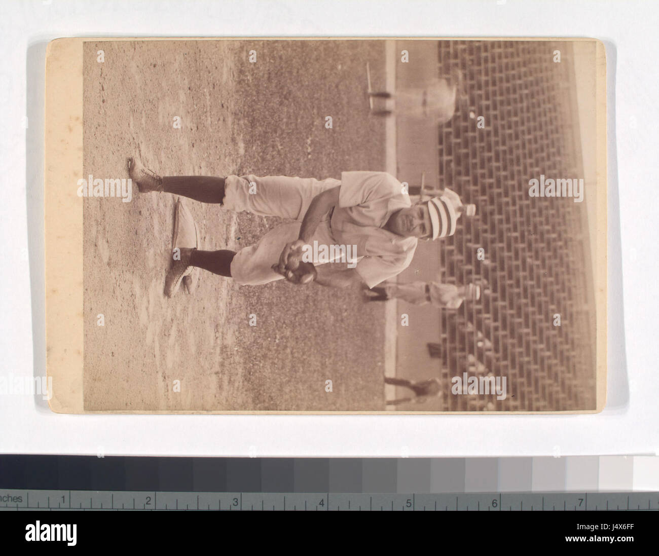 This image captures an unidentified baseball player in the catching ...