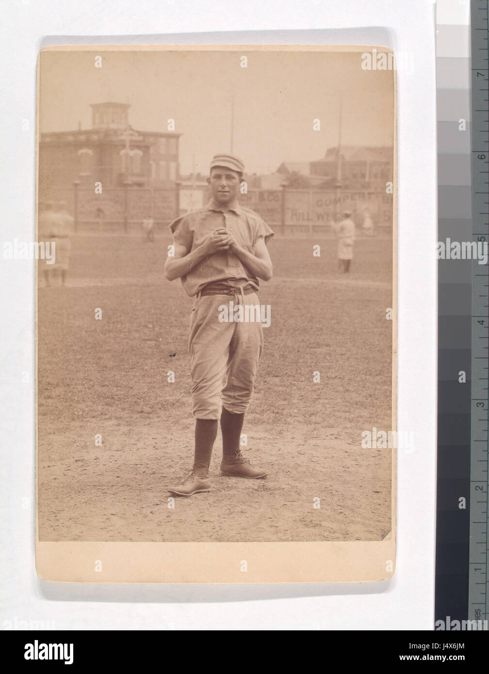 This image depicts an unidentified baseball player in pitching form ...