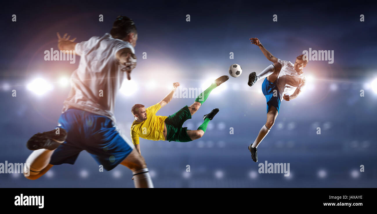 Soccer players in action on stadium fighting for ball. Mixed media ...