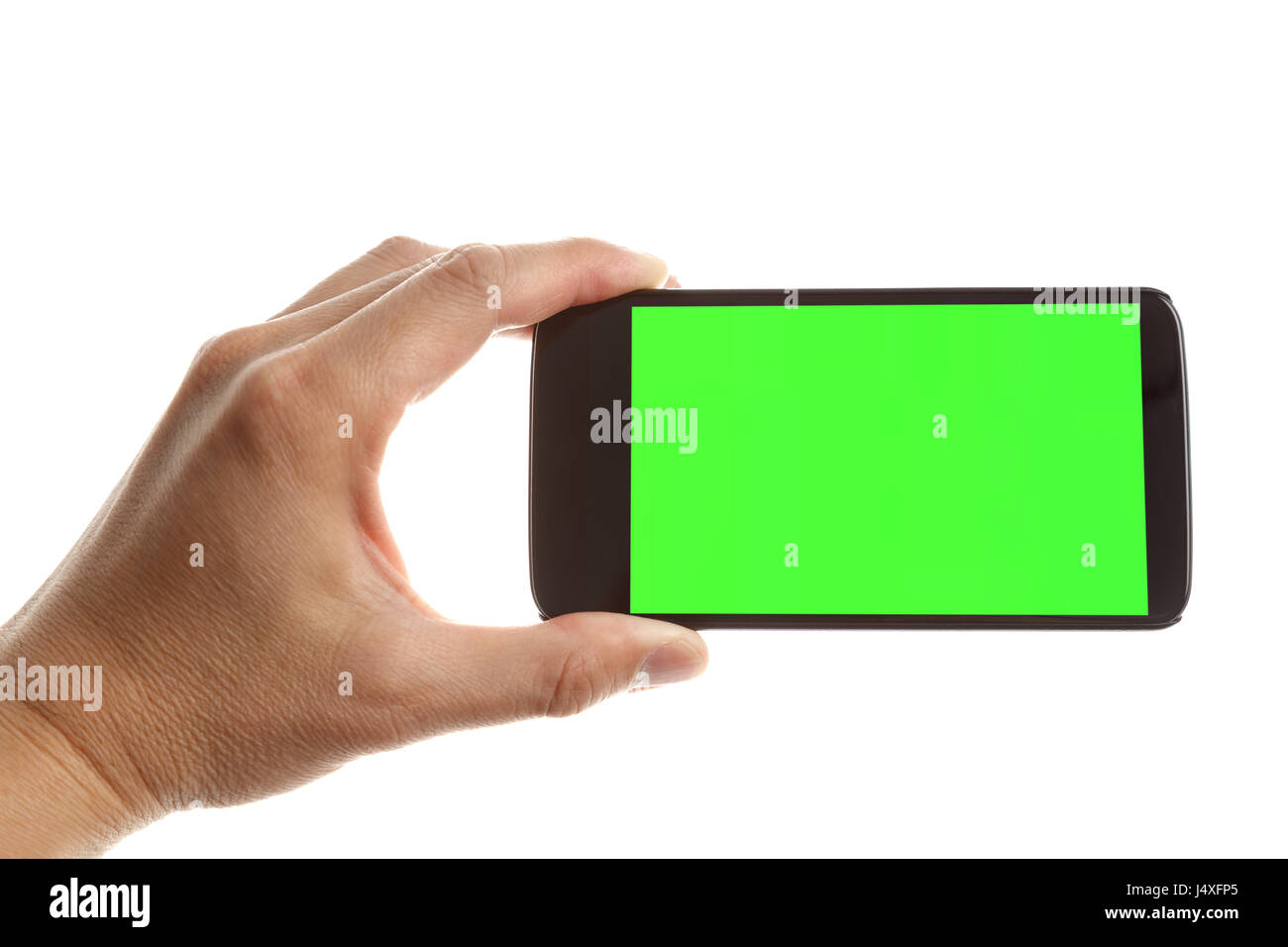 hand holding and showing smartphone with green screen. Isolated on ...