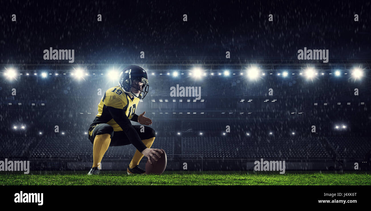 Two american football players fighting for ball. Mixed media Stock ...