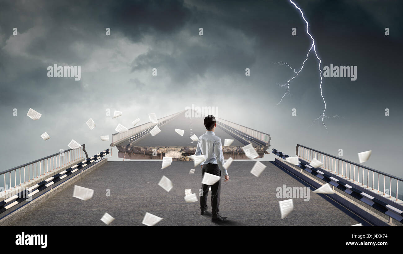 Businessman with suitcase standing on edge of bridge. Mixed media Stock ...