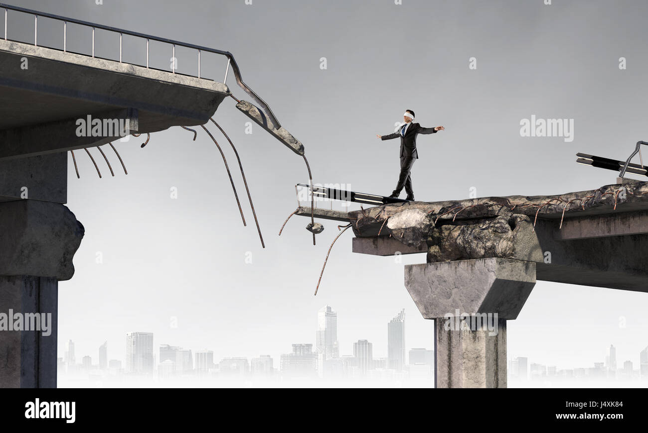 Blind businessman walking on edge of destructed bridge. Mixed media ...