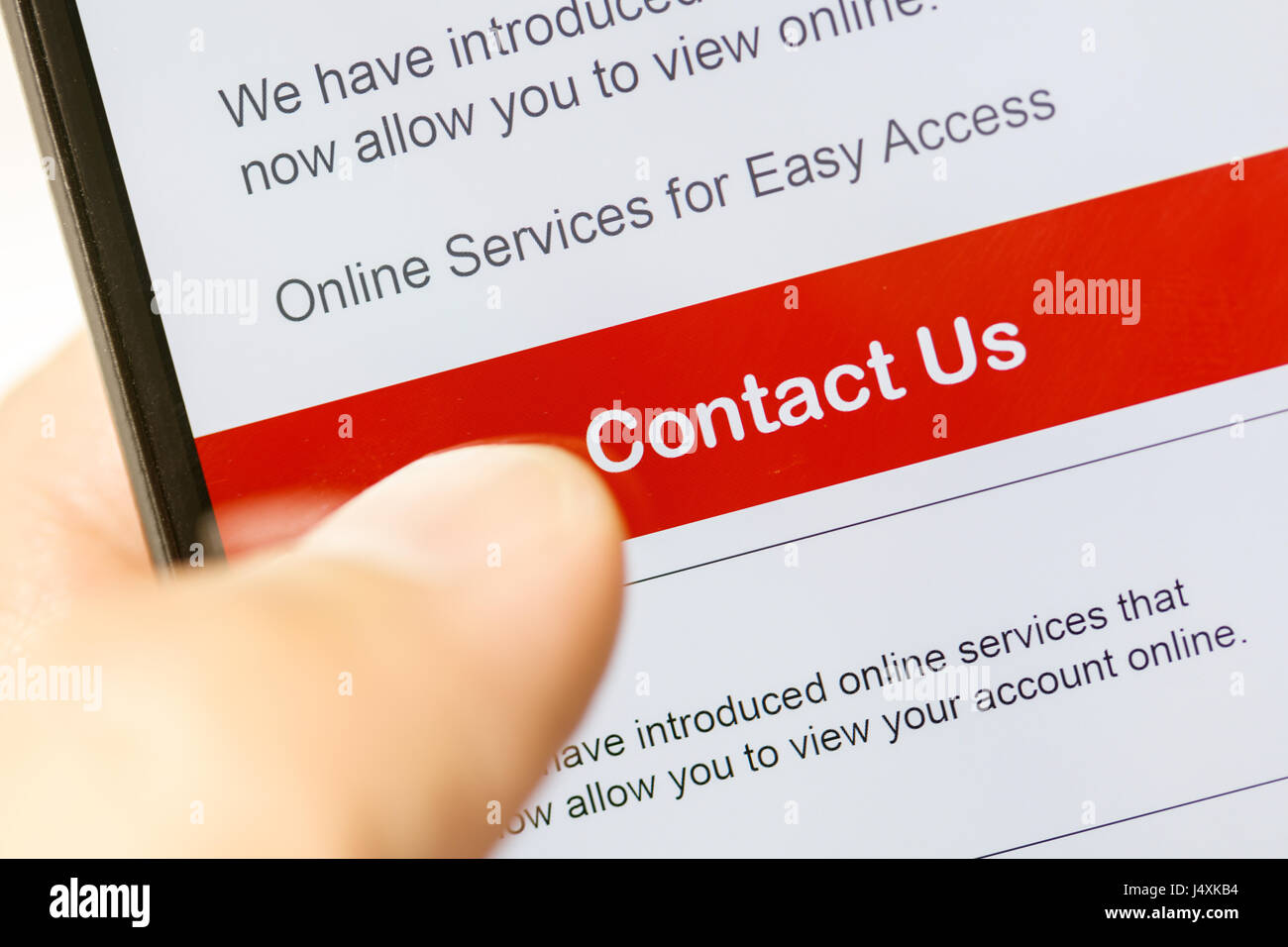 smartphone touch screen with red button contact us. business e-commerce ...