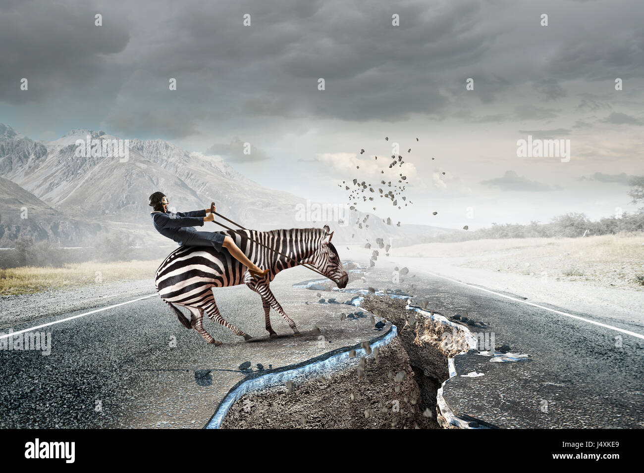 Young pretty fearless woman riding zebra animal Stock Photo - Alamy