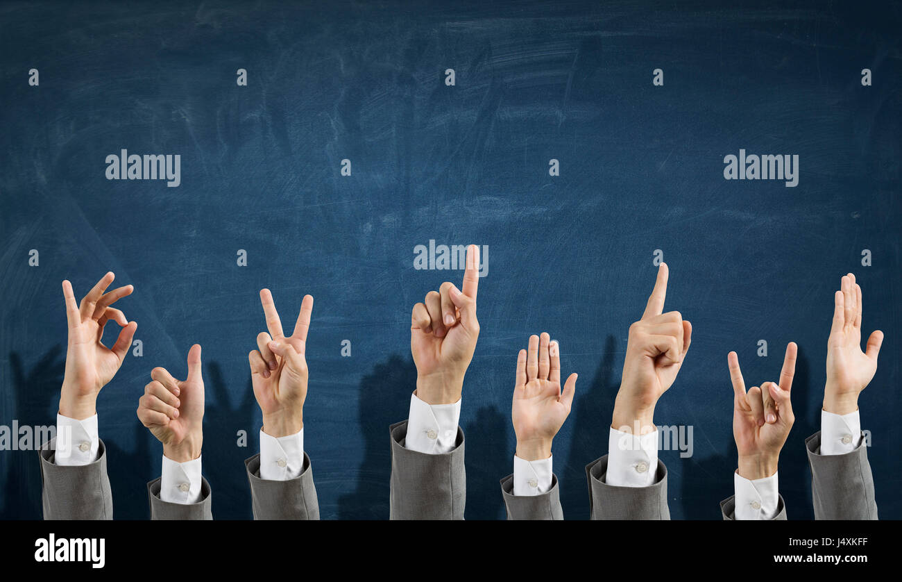 Many people in row raising upward hands showing participation Stock ...