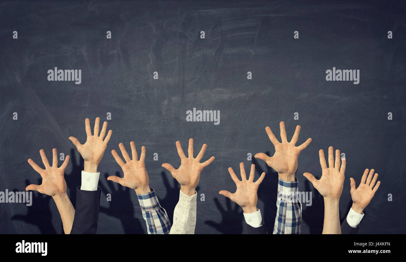 Many people in row raising upward hands showing participation Stock ...