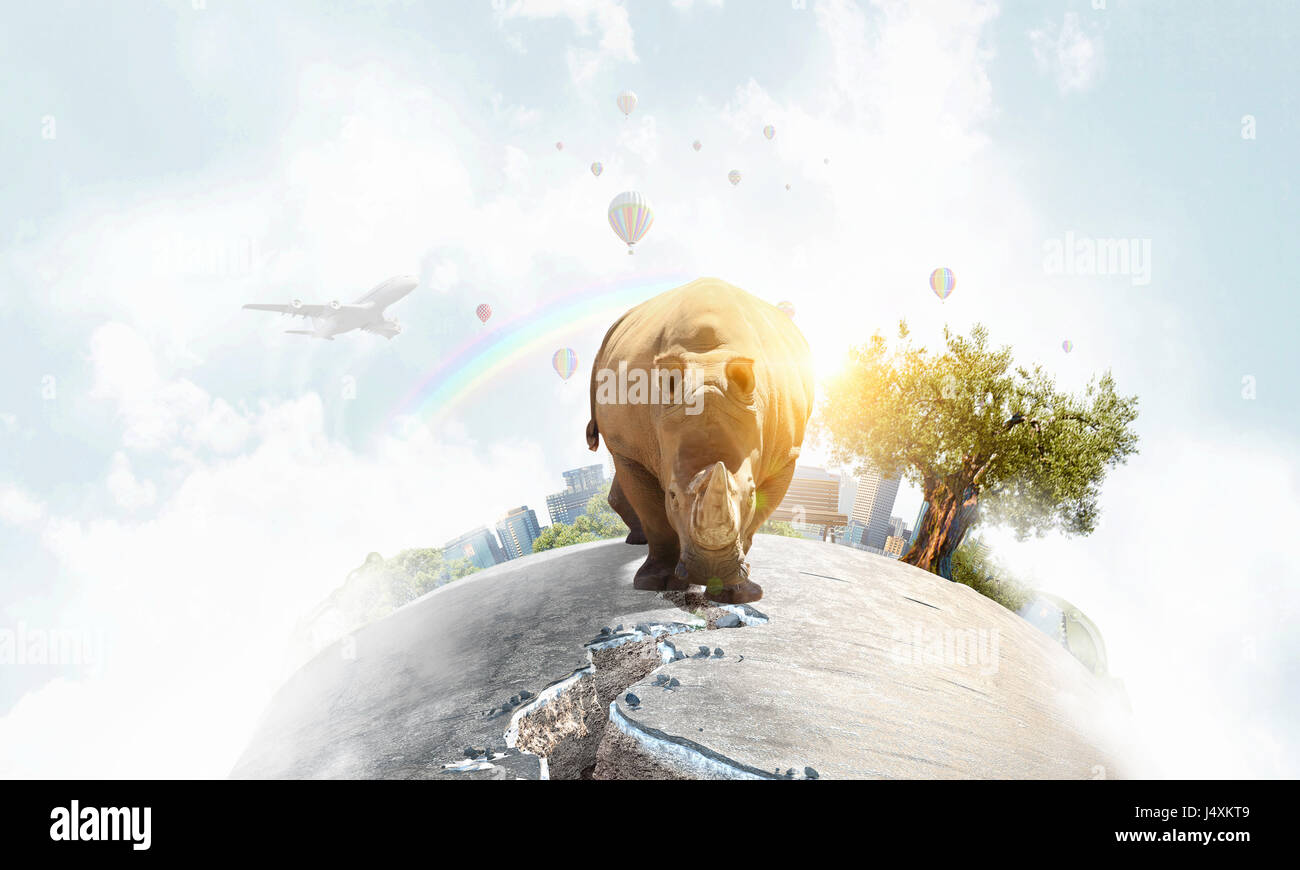 Big rhino animal outdoors as symbol of power and leadership Stock Photo ...