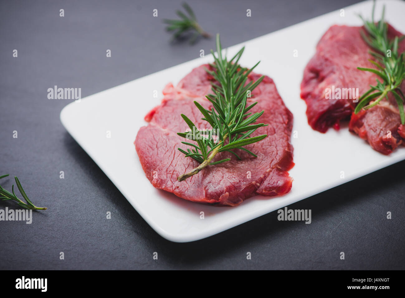 Raw beef meat sliced on a plate Stock Photo - Alamy