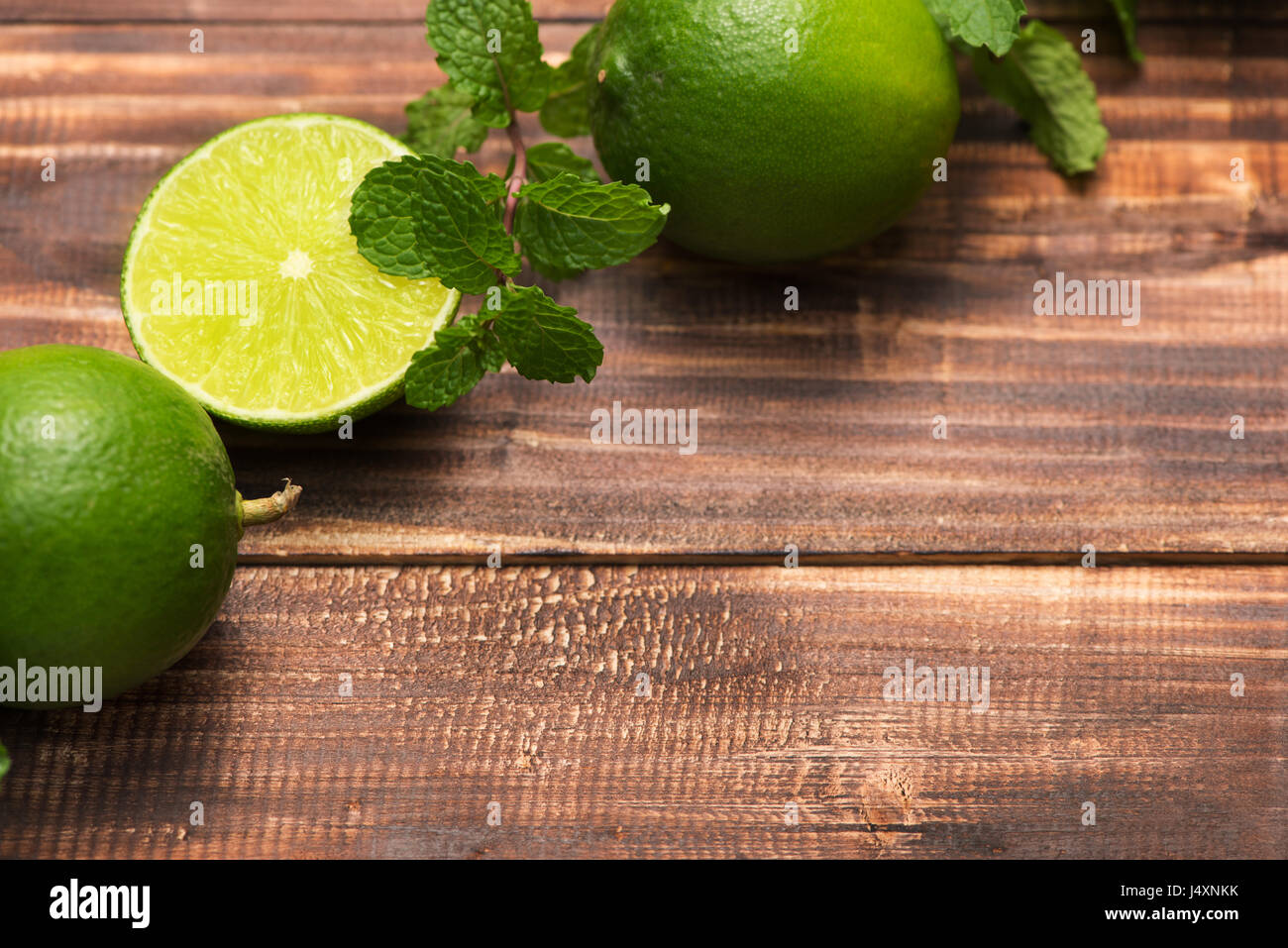 Fresh limes on wooden table, Top view, background Stock Photo - Alamy