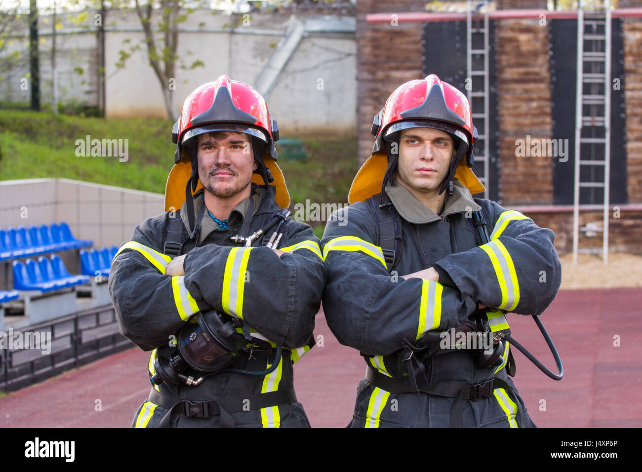 Portrait of two heroic fireman Stock Photo - Alamy