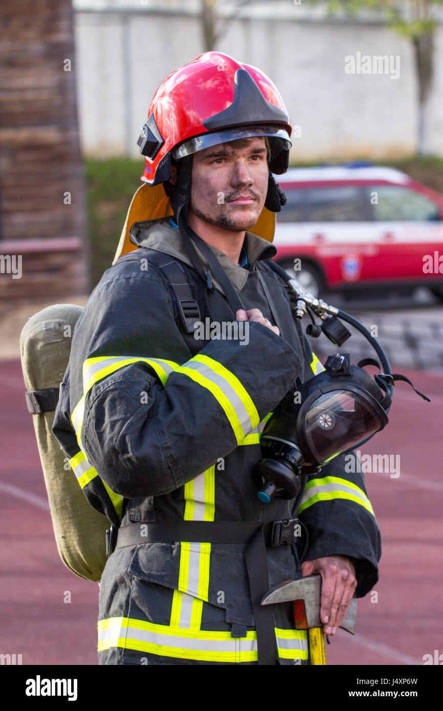 Portrait of heroic fireman with an axe outdoors Stock Photo - Alamy