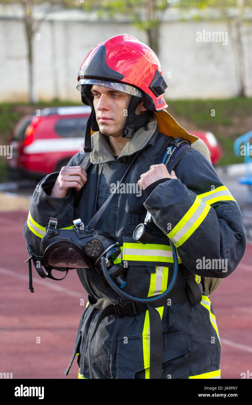 Portrait of heroic fireman with an axe outdoors Stock Photo - Alamy