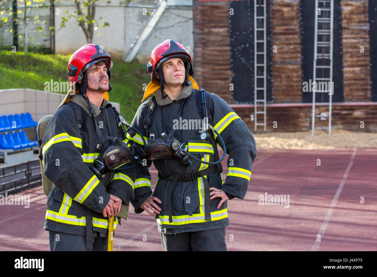 Portrait of two heroic fireman Stock Photo - Alamy