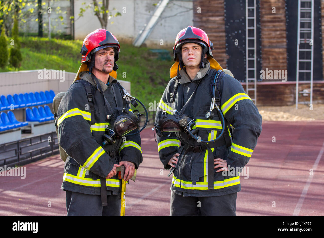 Portrait of two heroic fireman Stock Photo - Alamy