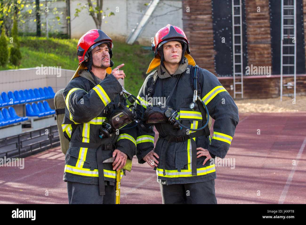 Portrait of two heroic fireman Stock Photo - Alamy